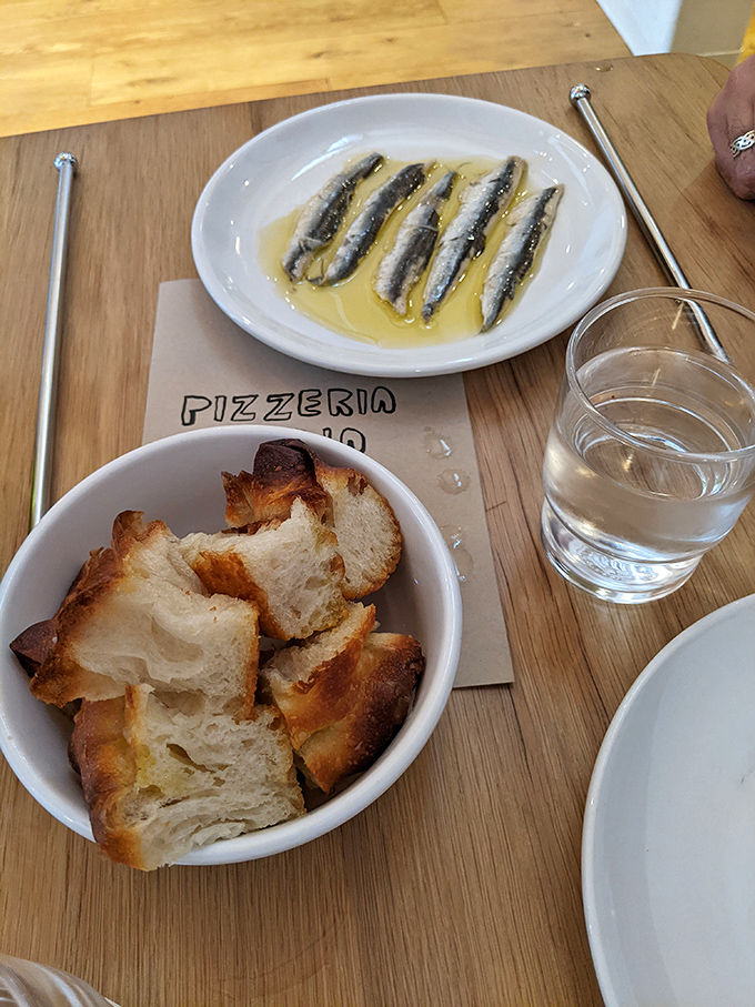 Cantabrian anchovies swimming in olive oil&mdash;the ocean's gift to your taste buds. Simplicity that speaks volumes about quality.