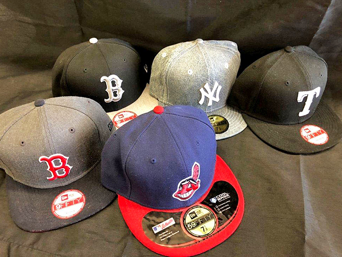 Baseball cap heaven for sports fans. Like a United Nations of team loyalty where Yankees and Red Sox fans must coexist peacefully.
