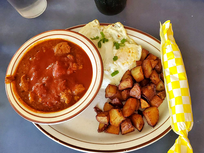 That red chile stew isn't just a side&mdash;it's the main event, with potatoes and eggs playing supporting roles in this flavor blockbuster.