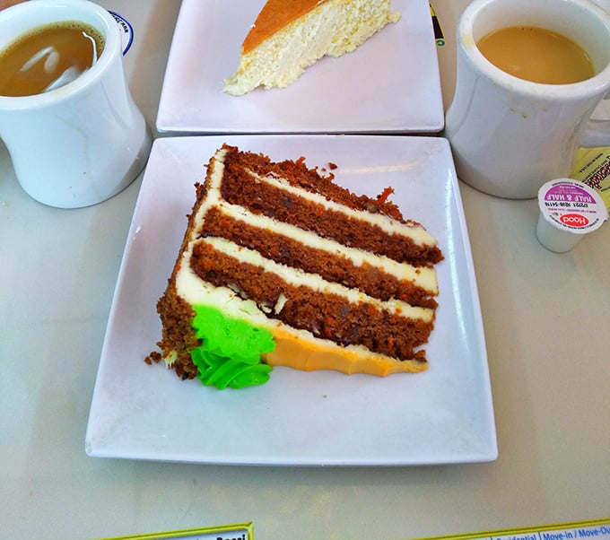 Layer upon layer of moist carrot cake with cream cheese frosting. Diet plans come here to die a deliciously sweet death.