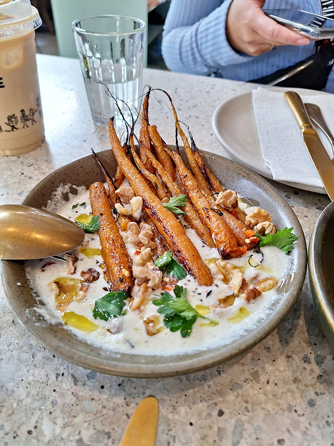 These aren't just roasted carrots; they're vegetable candy&mdash;sweet, earthy, and nestled in a creamy sauce that makes you question why vegetables ever needed a PR team.