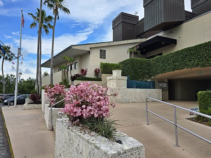 Florida's version of curb appeal: Pink bougainvillea greeting visitors with the kind of floral enthusiasm that makes northern gardeners weep with envy.
