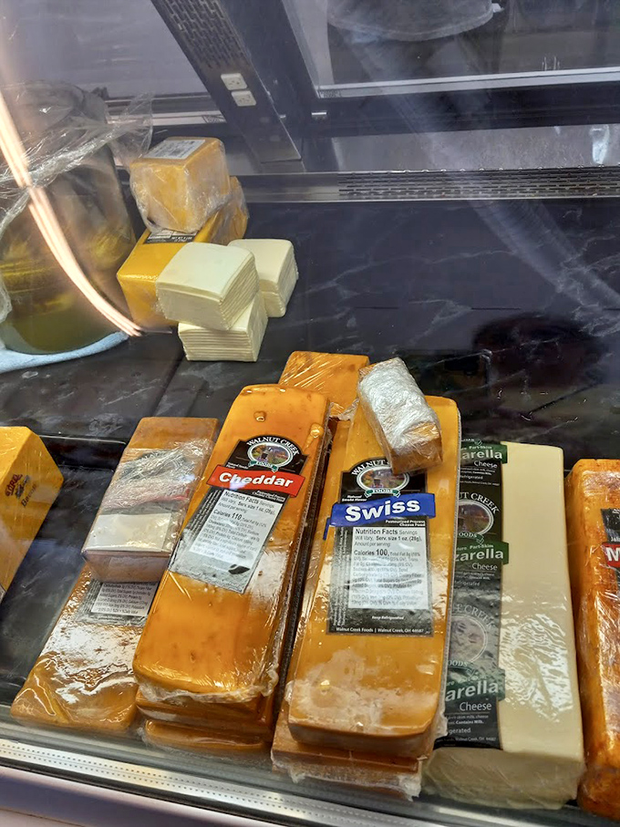 Blocks of golden goodness await their destiny &ndash; from Walnut Creek Swiss to sharp cheddar, this cheese case is where dreams begin.