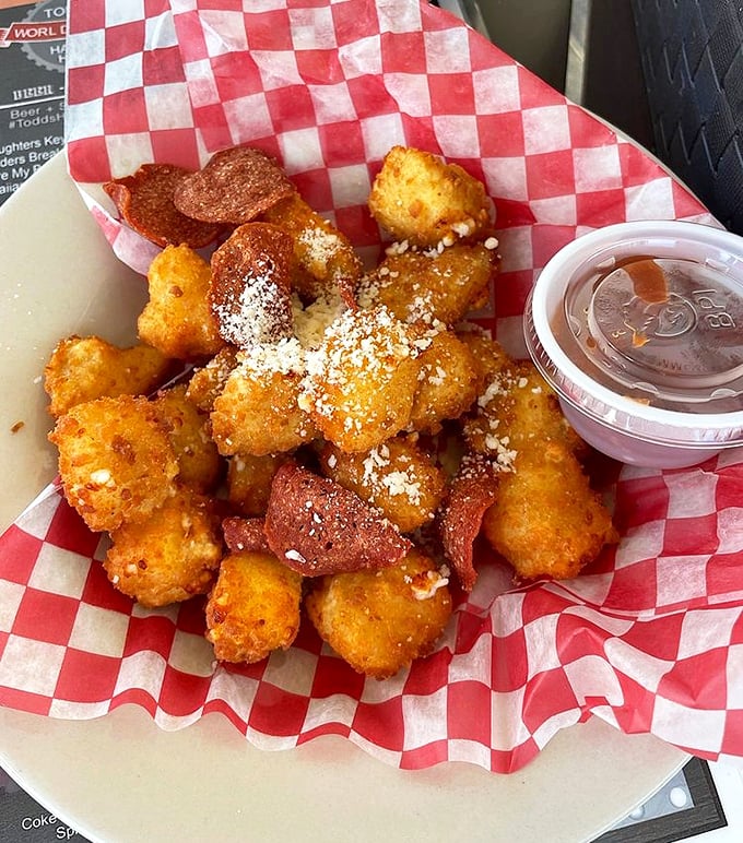 These golden cheese curds dusted with parmesan are what would happen if comfort food went to finishing school.