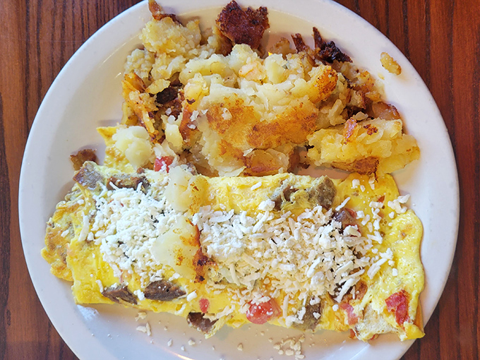 This cheese omelet with home fries isn't just breakfast&mdash;it's edible therapy, with each bite offering more comfort than your favorite childhood blanket.