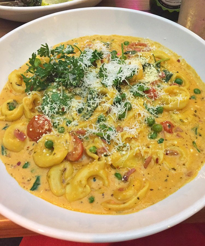 This tortellini dish isn't just colorful—it's practically performing a Broadway musical of flavors with each creamy, cheese-filled bite.