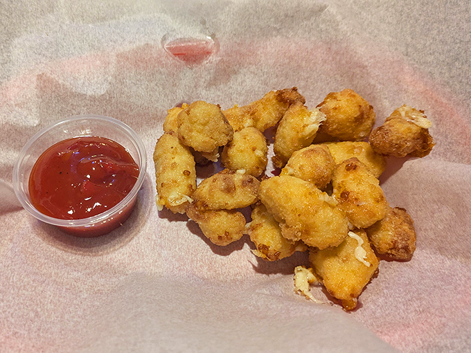 These golden cheese curds aren't just appetizers; they're little nuggets of joy that squeak between your teeth as Wisconsin intended.