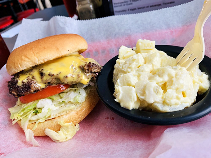 This isn't just a cheeseburger&mdash;it's therapy on a bun, with a side of potato salad that grandmothers everywhere would approve of.