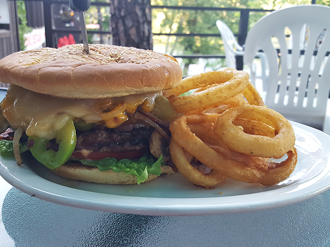 This isn't just a burger&mdash;it's architecture. The melted cheese cascading down the sides creates a delicious structural integrity that engineers would admire.