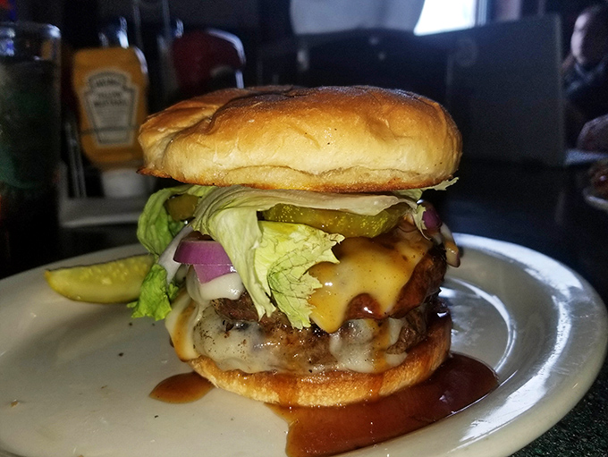 This isn't just a burger; it's a masterclass in balance—juicy patty, melty cheese, crisp lettuce, and that perfect pickle slice that cuts through the richness like a flavor ninja.