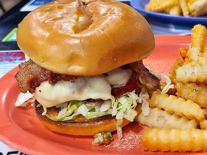 This isn't just a burger&mdash;it's architecture. Layers of bacon, cheese, and fresh veggies create a savory skyscraper that demands both hands and your full attention.