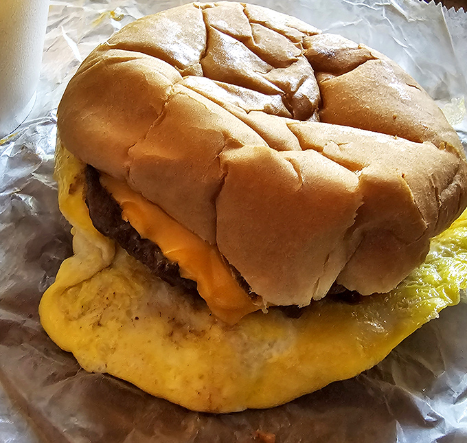 This isn't just a cheeseburger—it's edible nostalgia, wrapped in wax paper and served with a side of American perseverance.