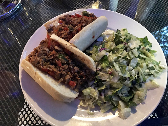 This isn't just a sandwich; it's a Pennsylvania tradition on a plate. The cheesesteak comes with a side of fresh, crisp salad for that "yes, I'm being somewhat healthy" feeling.
