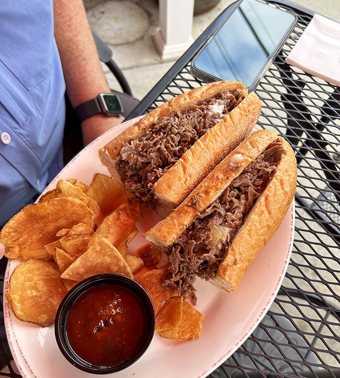 Behold the brisket sandwich—tender, smoky meat piled higher than your weekend expectations, with chips that crunch like autumn leaves.