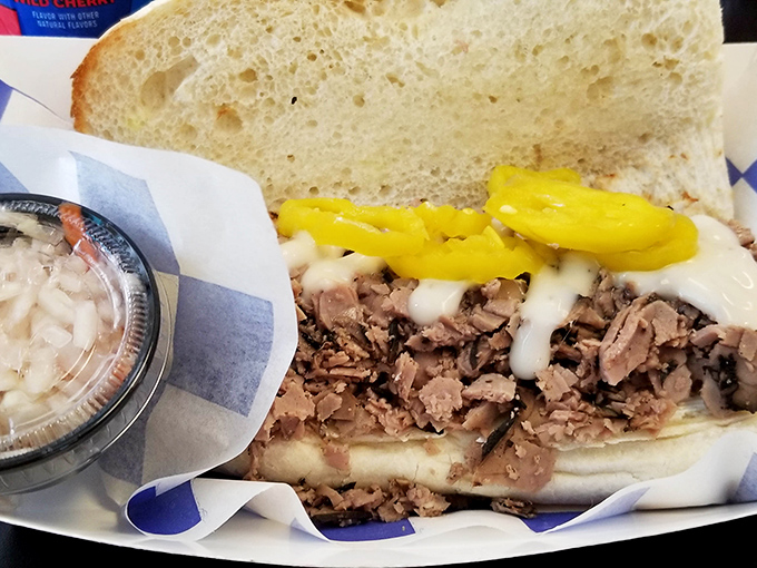 This isn't just a sandwich; it's an architectural marvel of thinly-sliced beef, melted cheese, and banana peppers that demands to be devoured.