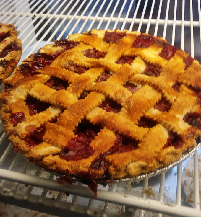 That lattice crust isn't just showing off&mdash;it's a golden-brown window into a world where cherries have found their highest calling.