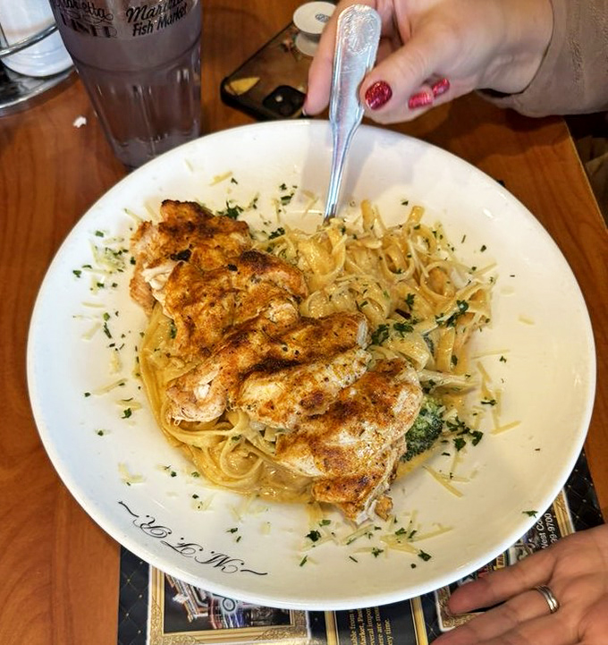 Blackened chicken perches atop a throne of pasta like a monarch surveying its delicious kingdom, daring you not to clean your plate.