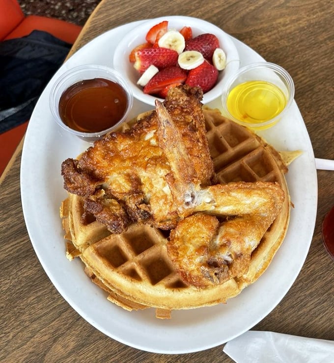 Chicken and waffles: the breakfast-dinner hybrid that proves some of the best relationships are unexpected ones. That fresh fruit is fooling nobody.