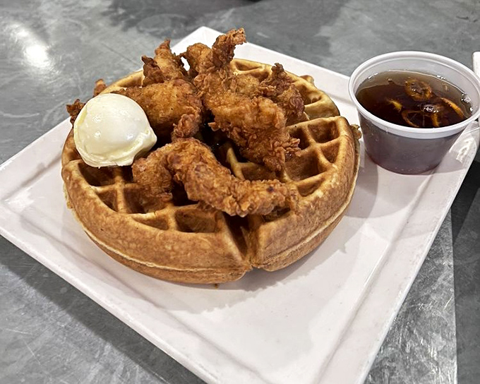 Chicken and waffles: the breakfast equivalent of a perfect marriage. Crispy fried chicken perched atop a golden waffle with syrup standing by for sweet-savory harmony.