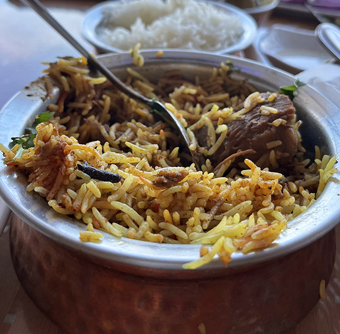 Biryani that speaks volumes &ndash; fragrant rice interlaced with tender meat and warming spices, a dish that whispers stories of distant bazaars.