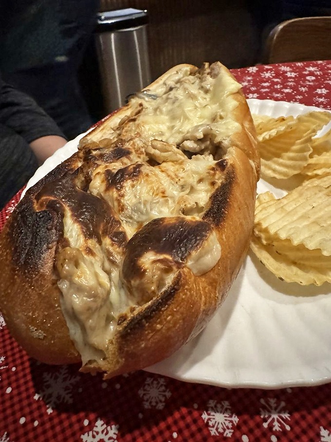 Behold the chicken cheesesteak in its natural habitat&mdash;gloriously melty, perfectly toasted, and flanked by ridged potato chips standing at attention. 