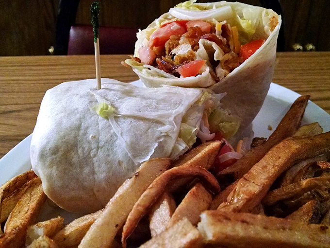 A wrap that requires both hands and a strategy. Those fries aren't a side dish&mdash;they're co-stars in this lunch production.