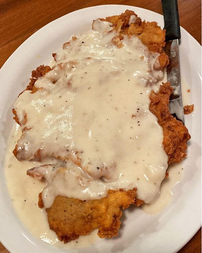 Chicken fried steak swimming in creamy gravy&mdash;the Texas equivalent of a warm hug from your favorite aunt who never understood portion control.