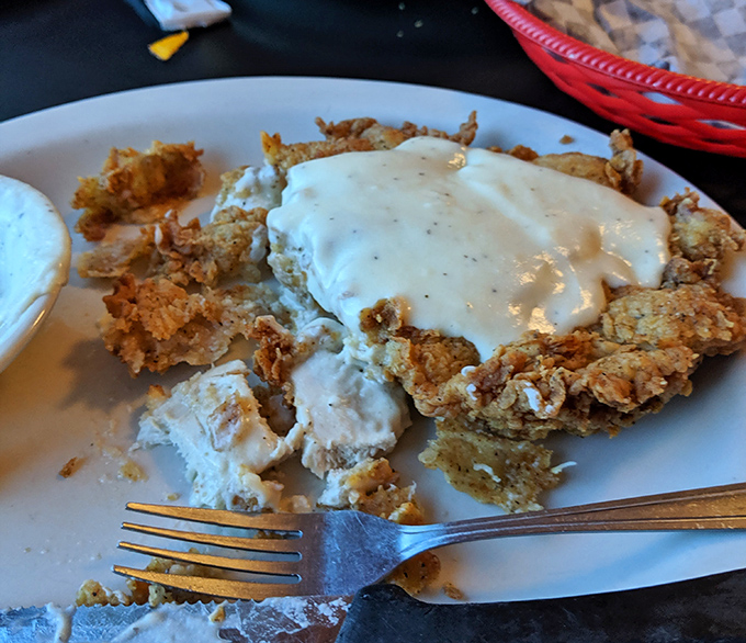 Chicken fried steak with cream gravy so good it should require a permission slip. This is Texas comfort on a plate.