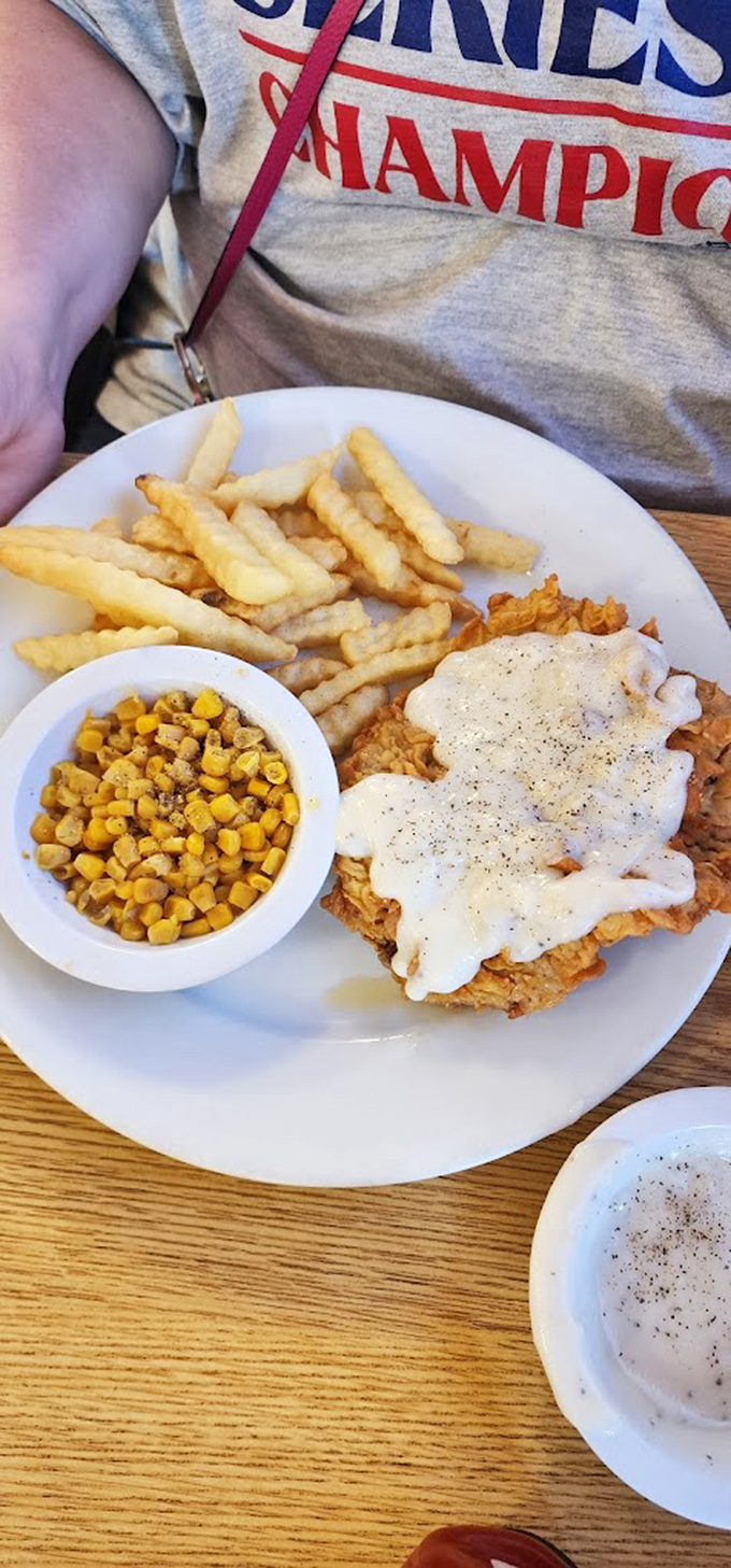 Chicken fried steak that's been baptized in cream gravy, served with golden fries and corn that tastes like summer. Diet starts tomorrow!