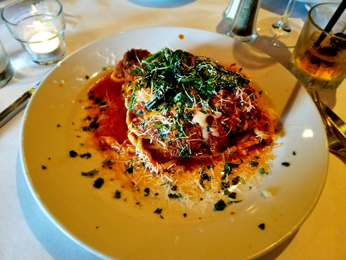 This pasta masterpiece showcases Z Cucina's commitment to Italian tradition—layers of flavor topped with fresh herbs and a shower of cheese. Comfort food elevated.