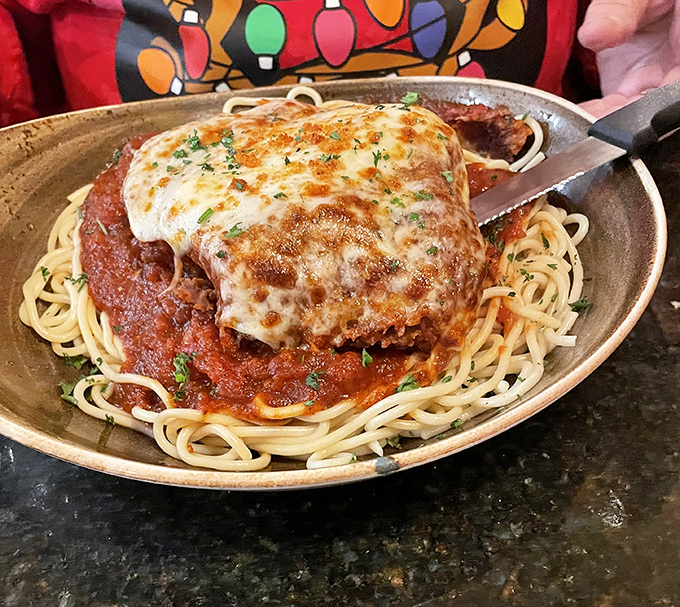 Chicken Parmesan that would make any Italian grandmother nod in approval. That golden cheese blanket and vibrant sauce prove some classics never need reinvention. 