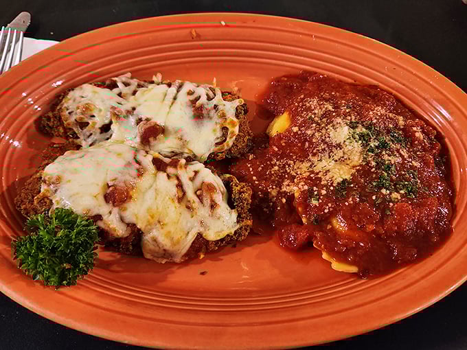Chicken Parmesan that doesn't know when to quit, with cheese that stretches from plate to mouth like it's auditioning for a food commercial.