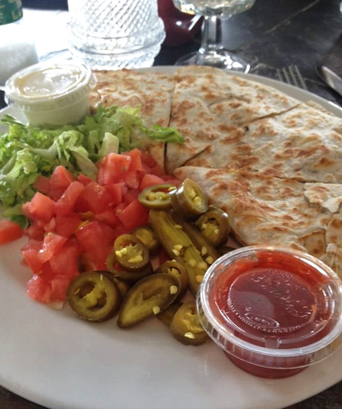 Not just any quesadilla&mdash;this one's a fiesta of flavors with jalape&ntilde;os standing guard like spicy little sentinels of satisfaction.