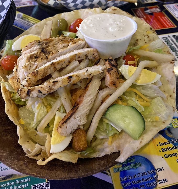 This isn't just a salad, it's a protein-packed flavor festival where grilled chicken and fresh vegetables throw a party on a tortilla.
