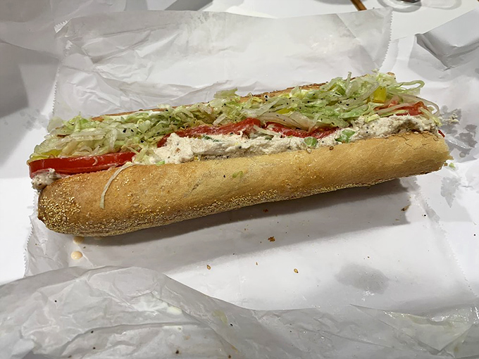 The chicken salad hoagie laughs at sad desk lunches everywhere. This is what bread dreams of becoming when it grows up.