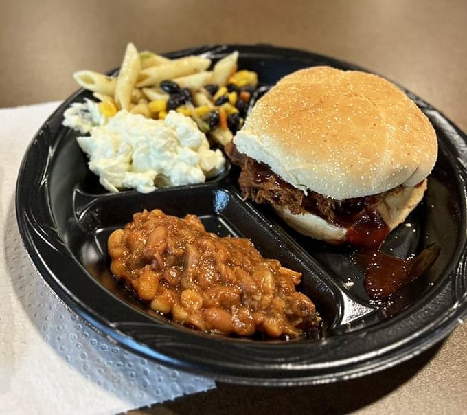 This isn't just a sandwich; it's an architectural marvel of pulled meat, sauce, and sides that demands both your respect and your appetite.