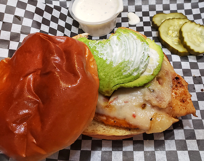 Avocado slices fanned out like a hand of winning cards atop this chicken sandwich. The pickle chips are the perfect sidekick.
