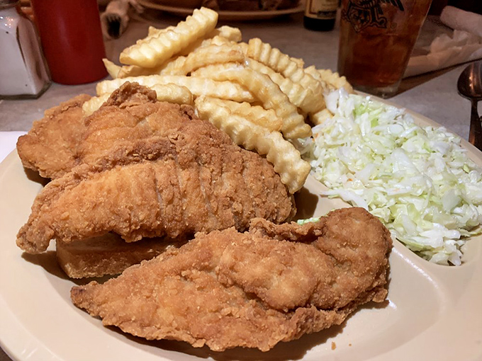 Fried chicken that makes you question why you ever bothered with fancy restaurants. Paired with crinkle-cut fries and coleslaw, it's the holy trinity of comfort.