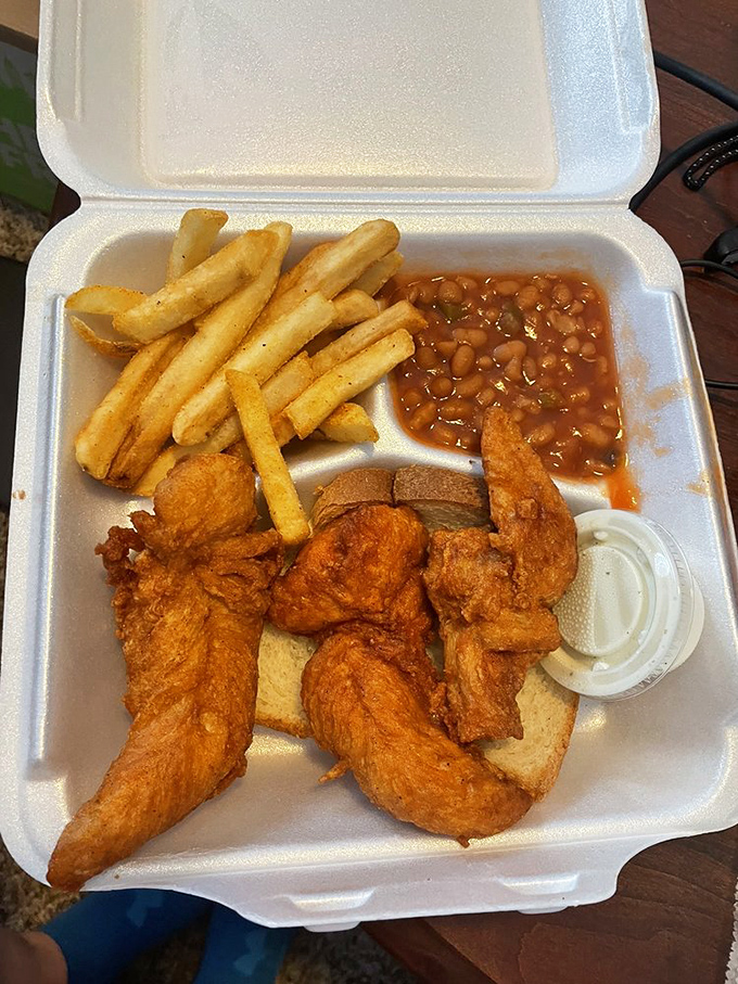 Golden tenders, seasoned fries, and beans that could make a vegetarian question their life choices. The to-go box of champions.