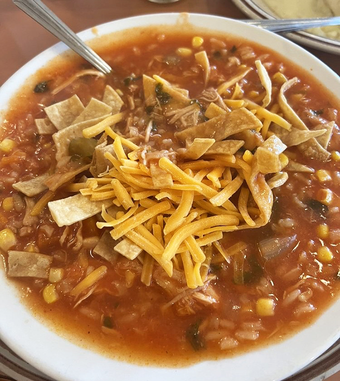 Chicken tortilla soup that puts grandma's to shame (sorry, Nana). A fiesta of flavors topped with crispy tortilla strips and melty cheese.