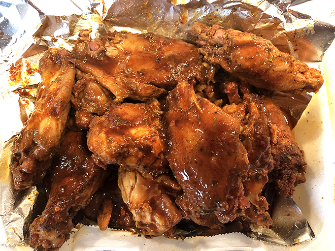 These chicken wings have clearly been introduced to smoke and spice in a meaningful, long-term relationship. The glossy sauce is just the final love letter.