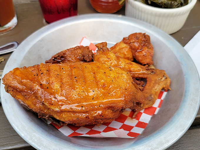Fried chicken that's worth crossing state lines for—crispy, golden-brown, and drizzled with honey that catches the light like liquid amber.