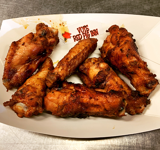 Wings so perfectly charred they could win a beauty pageant for poultry. The crispy exterior gives way to juicy meat that's absorbed all that smoky goodness.