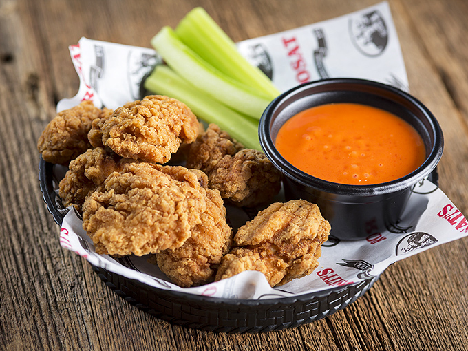 Golden-fried chicken wings that crunch like autumn leaves, paired with buffalo sauce that brings just enough heat to make you reach for your beer.
