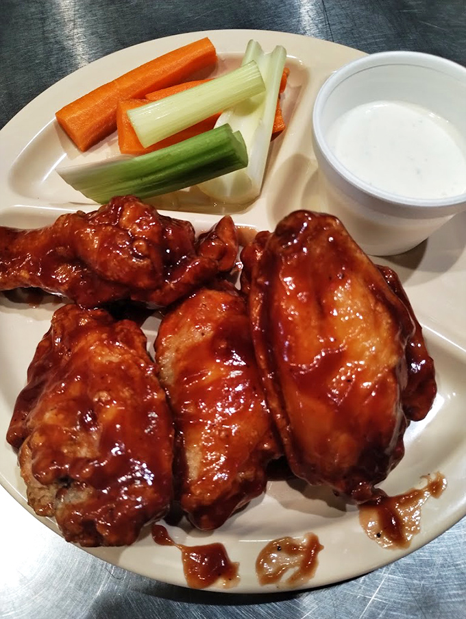 Chicken wings that look like they've been dipped in barbecue heaven &ndash; glistening with sauce and begging to be devoured.