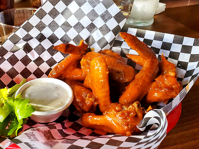 These aren't just wings; they're a masterclass in texture. Crispy, glistening, and tossed in sauce that demands you lick your fingers with zero shame.
