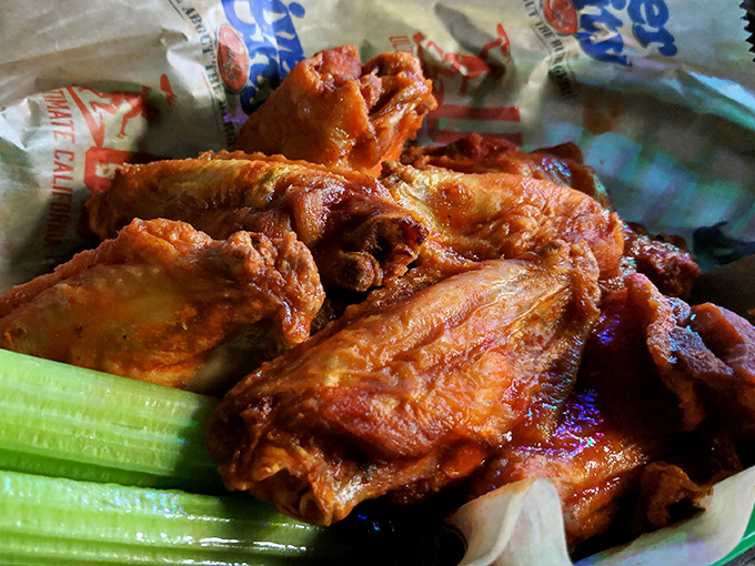 Wings so perfectly crispy and saucy they'd make even the most dignified diner consider licking their fingers in public.