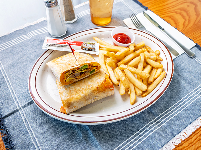 The breakfast wrap &ndash; where morning ingredients find their true calling wrapped in a warm tortilla, with fries standing by for moral support.