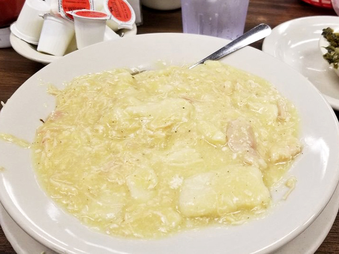 Chicken and dumplings so comforting they could end family feuds&mdash;a creamy cloud of Southern nostalgia served on classic diner china.