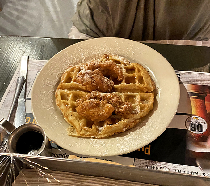 Chicken and waffles: where breakfast and dinner collide in a powdered sugar paradise that would make your grandmother both confused and proud.